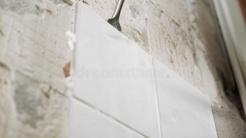 Slow Motion of a Rotary Hammer Breaking Ceramic Tiles Off a Wall Stock ...