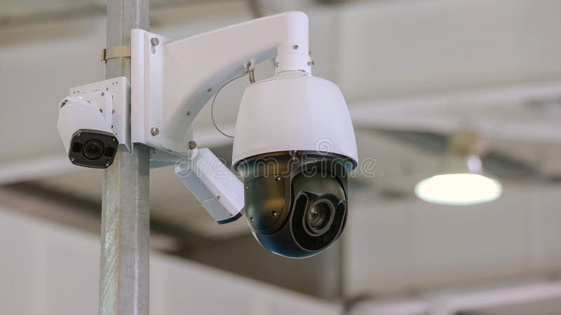 Rotating Black Surveillance Control Camera Indoors. Stock Image - Image ...