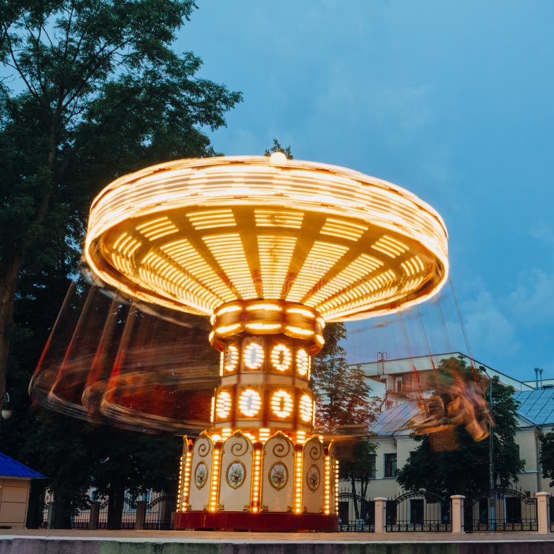 A Working Carousel in the Evening Hours in the Park Stock Photo - Image ...