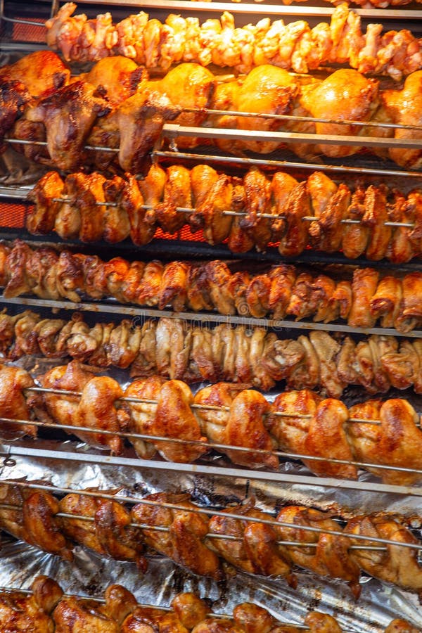 Rotating chicken grilling stock image. Image of heated - 285887593
