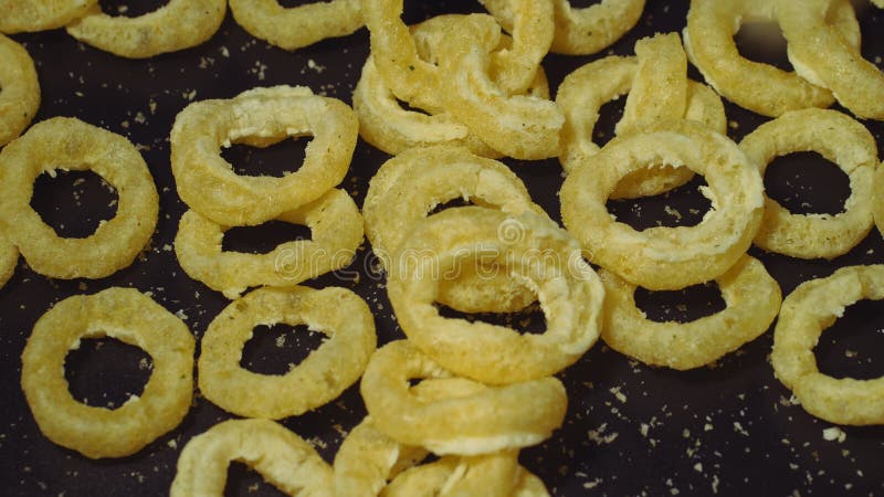 Rotating Corn Rings on a Black Background. Onion Rings Stock Footage ...