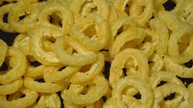 Rotating Corn Rings on a Black Background. Onion Rings Stock Footage ...