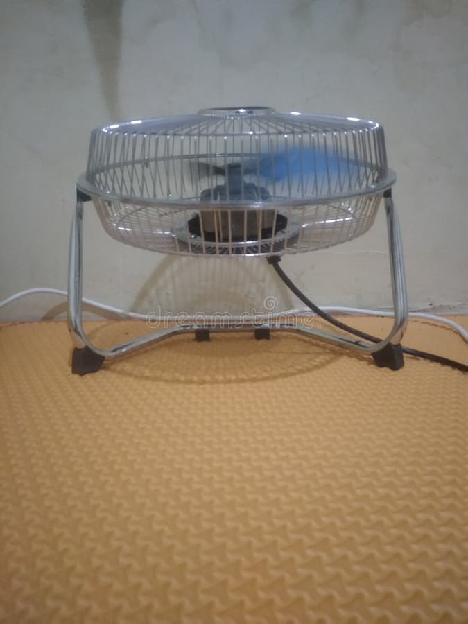 Rotating fan facing up stock image. Image of blowing - 261625273