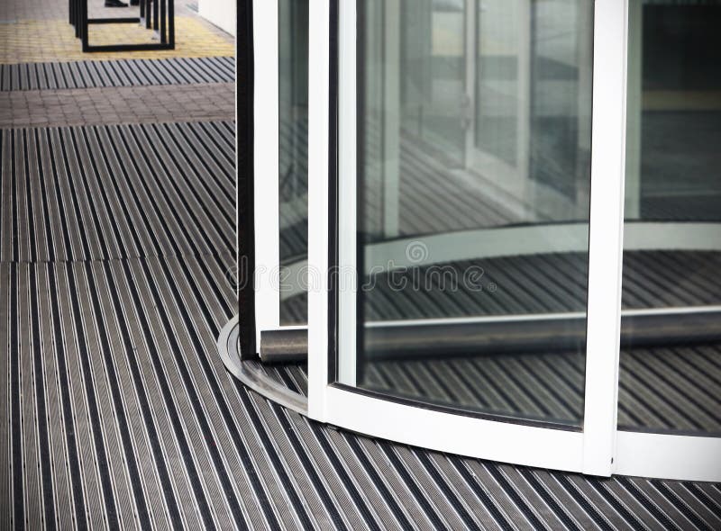 Rotating Glass Round Door Element on Wooden Floor Stock Image - Image ...