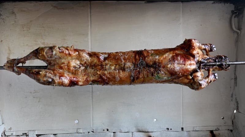 Rotating lamb on the spit stock footage. Video of cooking - 246250888