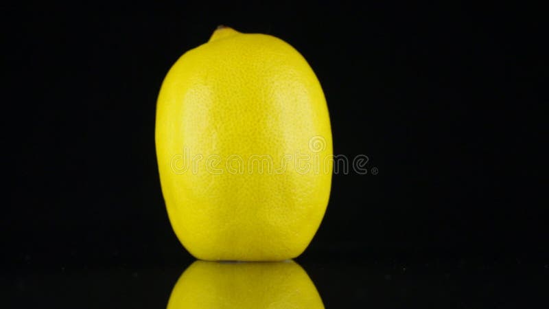 Rotating Lemon and Its Reflection on a Black Background. Stock Video ...