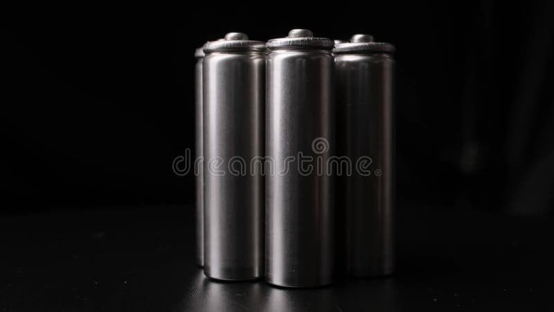 Rotating Metallic Batteries in Studio Setting with Dark Background and ...