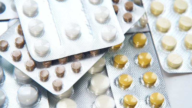 Rotating Overall View of Pharmaceutical Tablets and Capsules in ...