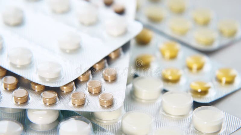 Rotating Overall View of Pharmaceutical Tablets and Capsules in ...