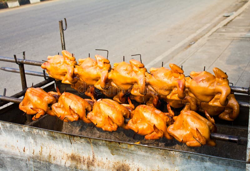 Rotating roast chicken stock image. Image of detail, grill - 19295281