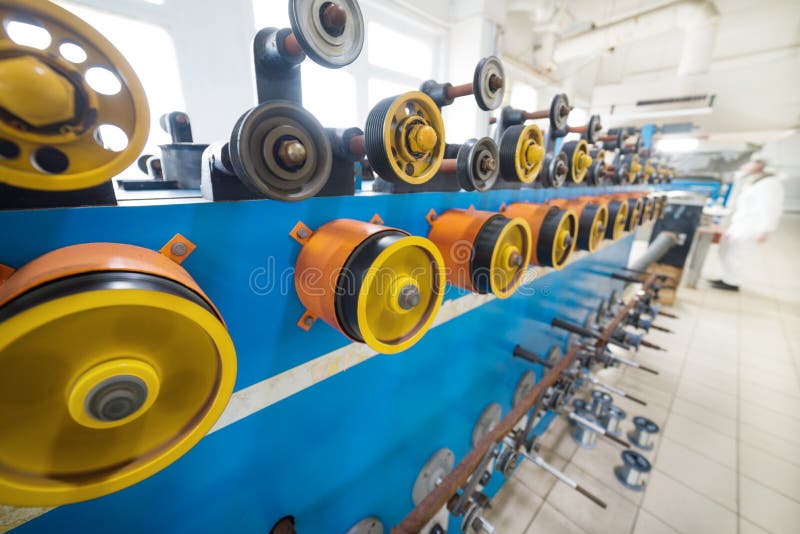 Rotating Rubberized Wheels of the Winding Machine. Stock Photo - Image ...