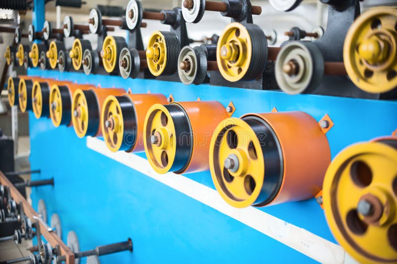 Rotating Rubberized Wheels of the Winding Machine. Stock Image - Image ...