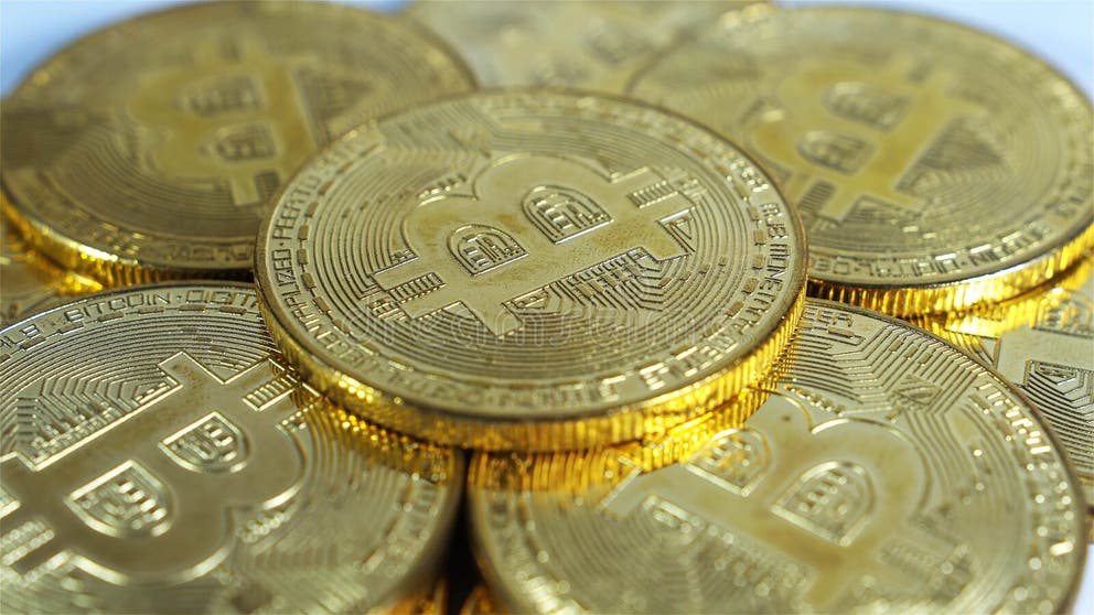 Rotating Stack of Gold Bitcoins on Turntable Stock Photo - Image of ...