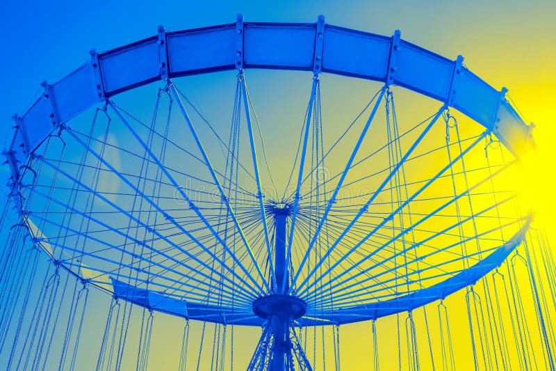 Rotating swing at sunset stock image. Image of fairground - 281755377