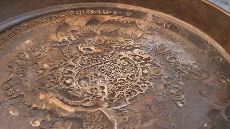 Rotating Top View of an Intricately Engraved Tarnished Copper Surface ...