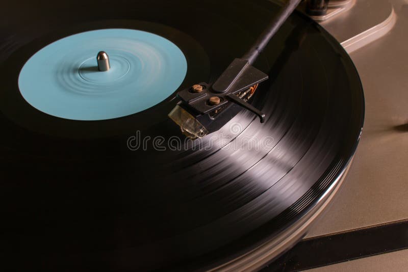 Rotating Vinyl Record with a Blue Mark on the Turntable Stock Photo ...