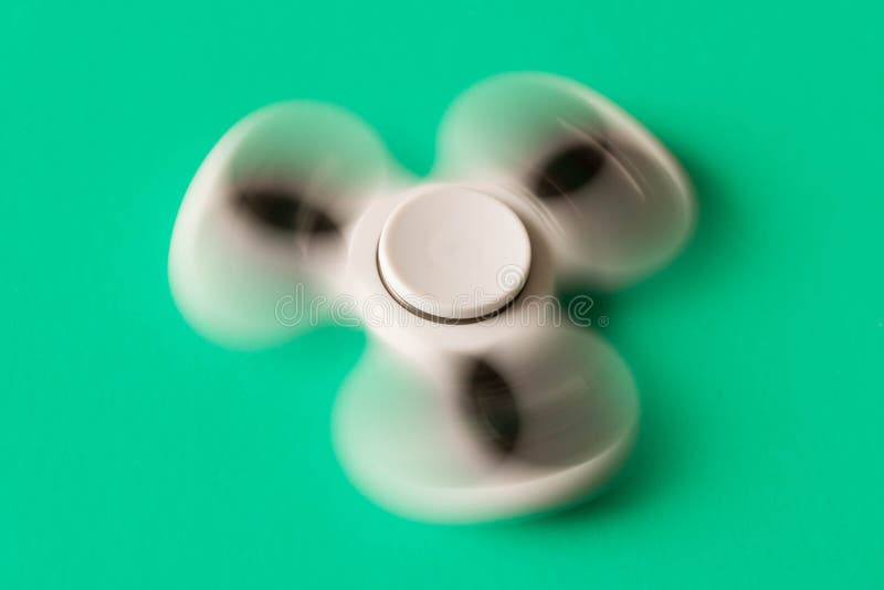 The Rotating Spinner . Isolated on Yellow Background Stock Image ...