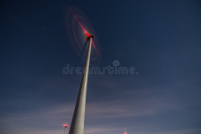 Rotating windmill stock image. Image of night, glowing - 140152555