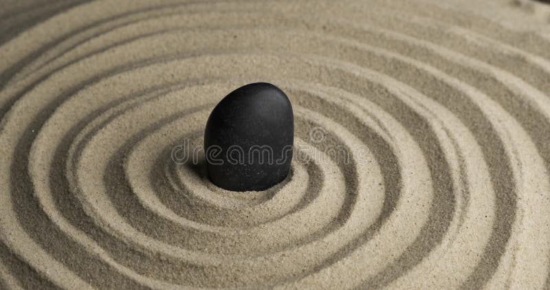 Rotation of the Black Stone in the Center of the Sand Spiral. Close-up ...