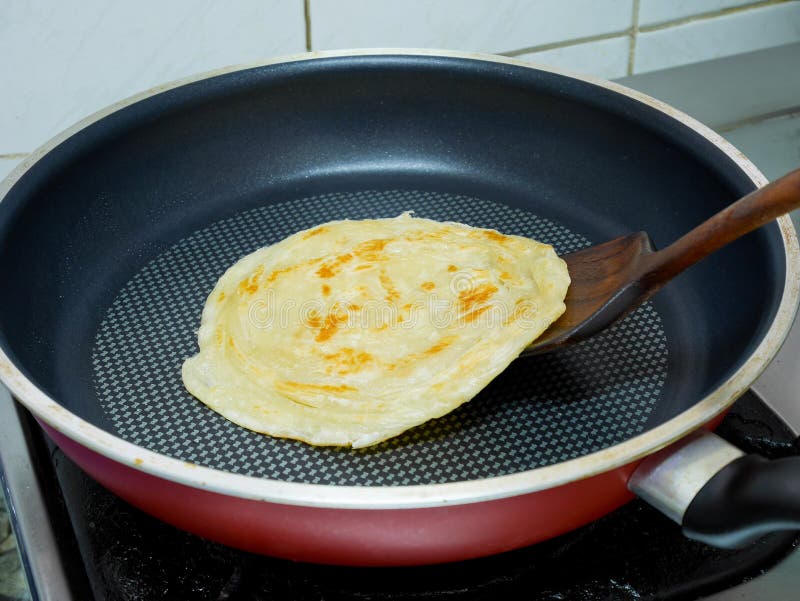 Roti canai cooked in a pan stock photo. Image of healthy - 380465130