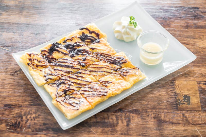 Roti with chocolate sauce stock photo. Image of milk - 119629776