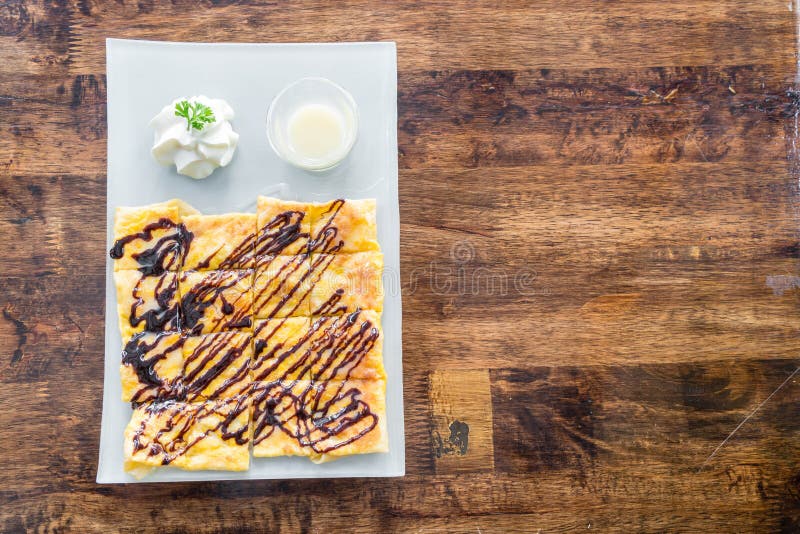 Roti with chocolate sauce stock image. Image of white - 119084811