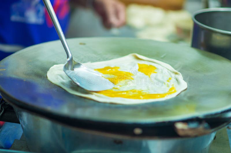 Roti while frying on pan stock photo. Image of obesity - 47171128