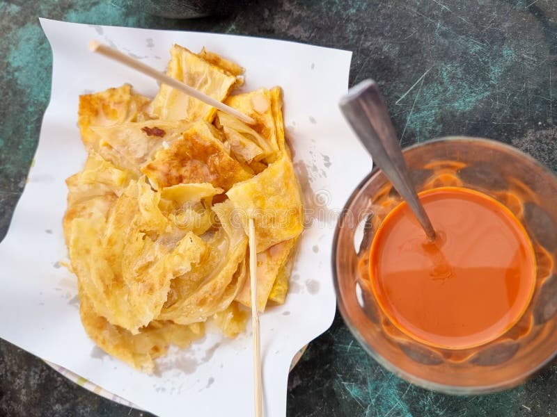 Roti and Hot Thai Tea on Green Table Stock Image - Image of traditional ...