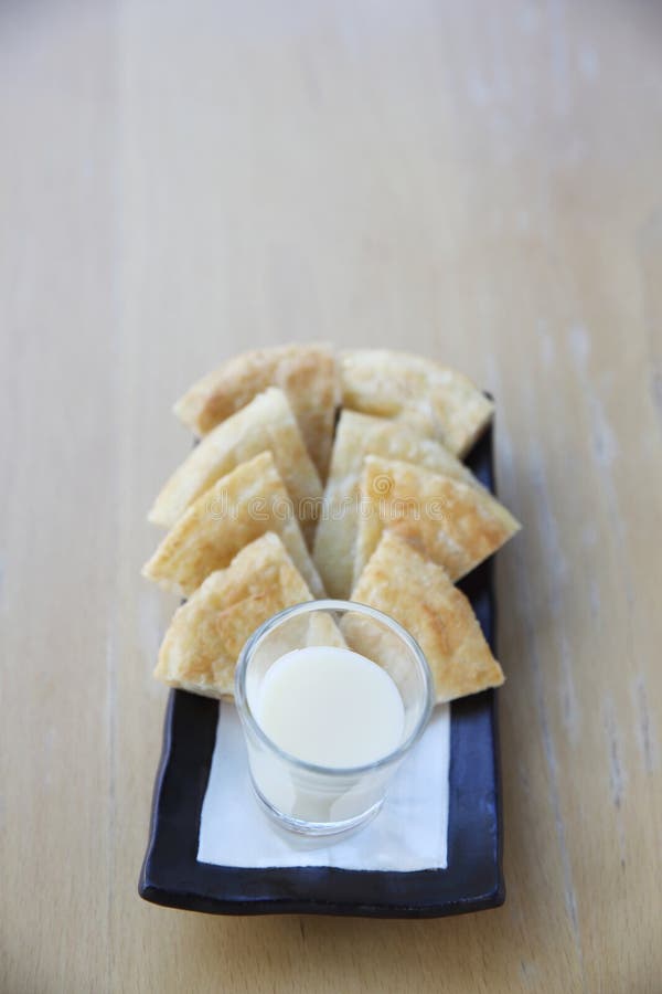 Roti with milk on a plate stock photo. Image of dinner - 136988246