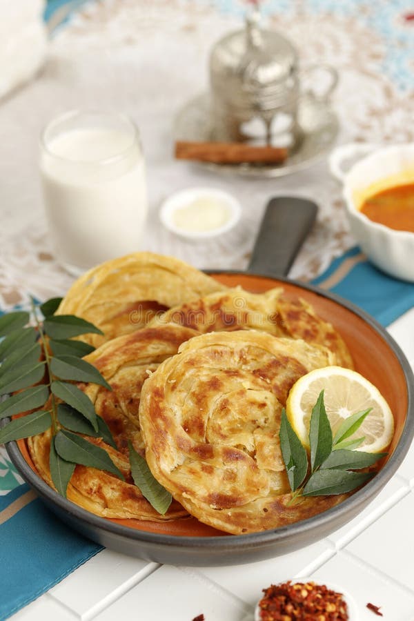 Roti Parata or Roti Canai with Lamb Curry Sauce Stock Photo - Image of ...