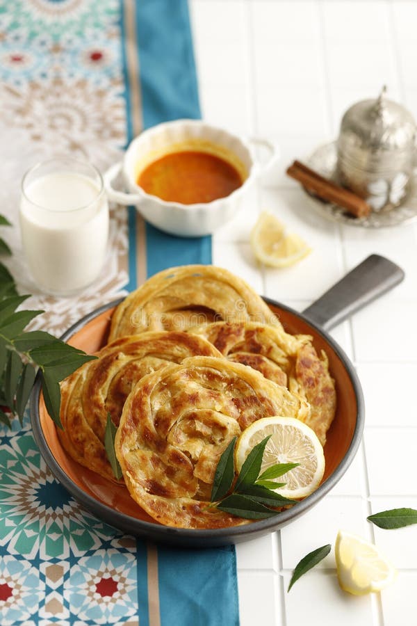 Roti Parata or Roti Canai with Lamb Curry Sauce Stock Image - Image of ...