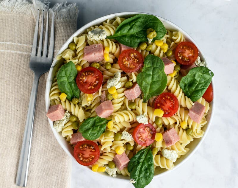 Rotini and Spam Pasta Salad with Corn, Peas and Spinach Stock Image ...