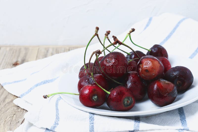 Rotten cherries on a plate stock photo. Image of poison - 125405264
