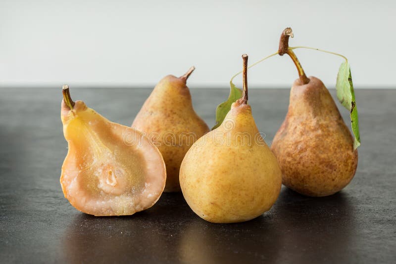 Rotten and Ripe Pear Lies on the Ground Cracked from Drought Stock ...