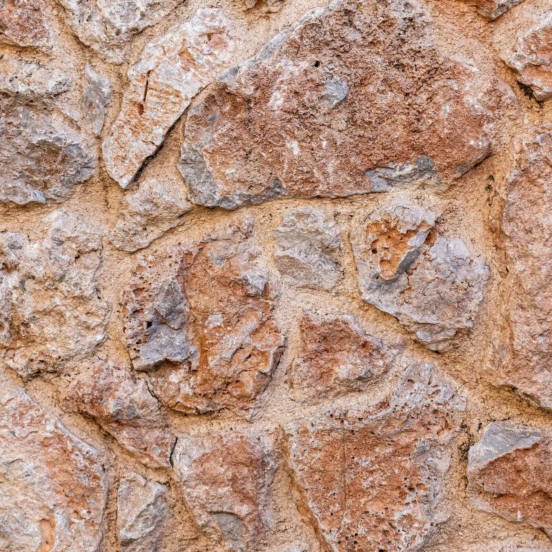A Rough Brown Stone Wall Close Up, Seamless Textured Background. Stock ...