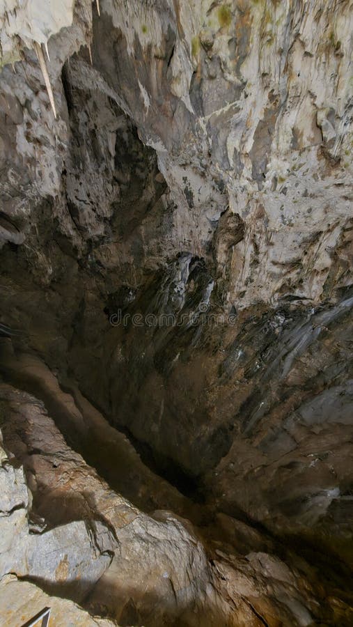 Rough Cave Interior with Jagged Rock Formations and a Dark, Deep Cavity ...