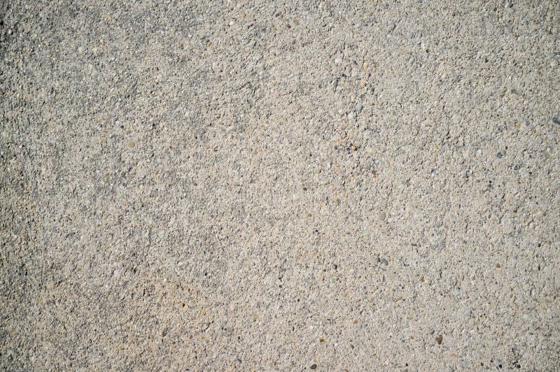 Rough Concrete Wall Texture with Small, Grey Rocks Embedded in Surface ...