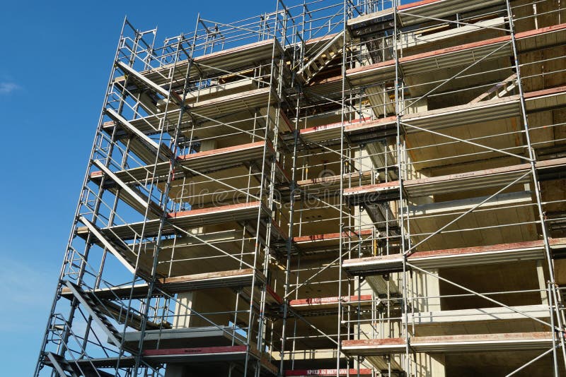 Rough Construction of a New Residential Building Covered by Scaffolding ...