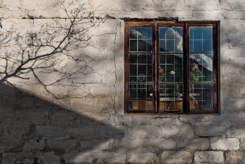 Rough Cracked Wall of an Old Building with a Shadow and a Window with ...