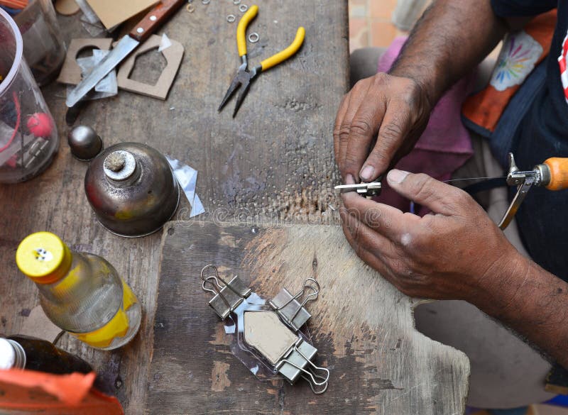 Rough and Dirty Hands are Working on Many Tools Placed on the Ta Stock ...