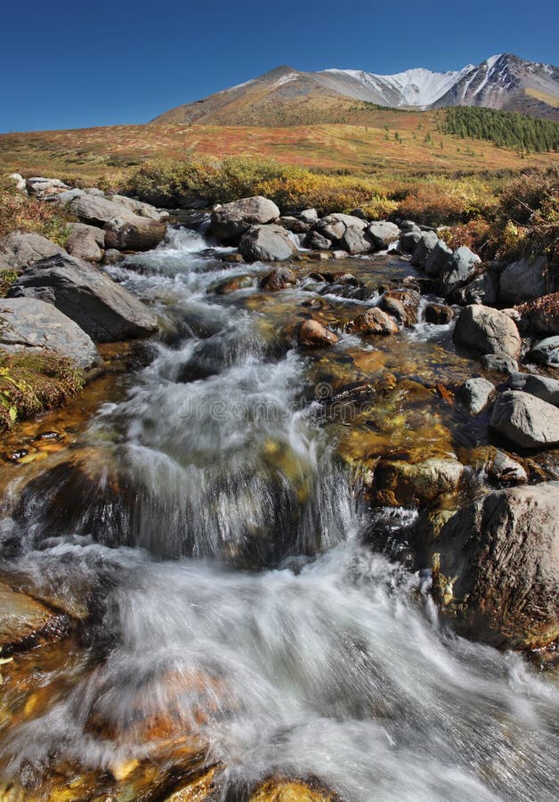 Stream of Clear Water Flowing Over Mossy Boulders Stock Photo - Image ...