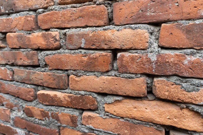 Rough red brick wall 4 stock photo. Image of iron, cobblestone - 207743268