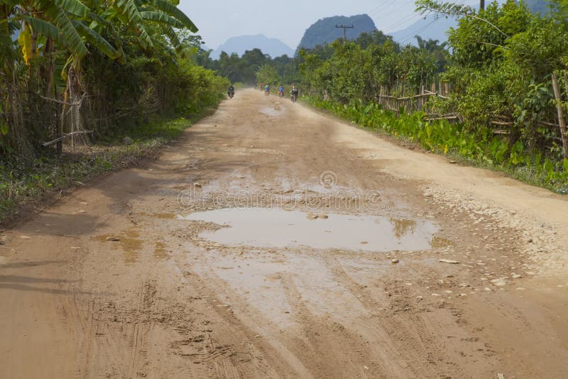 Rough Paved Road in a Countryside in a Sunny Late Afternoon Stock Image ...