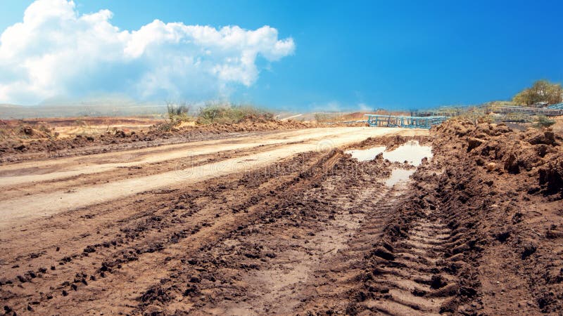 Rough Road in the Countryside. There are Mud Basins and Wheels Stock ...
