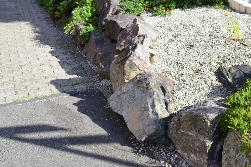 Rough Rocks at the Sidewalk Stock Photo - Image of ways, stonewall ...