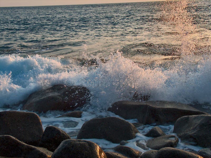 Rough sea at sunset stock image. Image of purple, coast - 44635379
