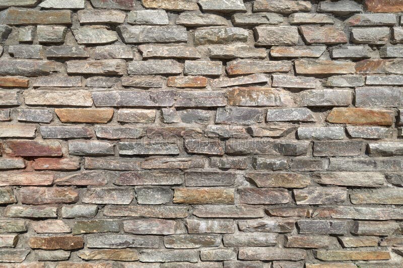 Rough Stone Wall Made of Ceramic Tiles of Different Sizes and Colors ...