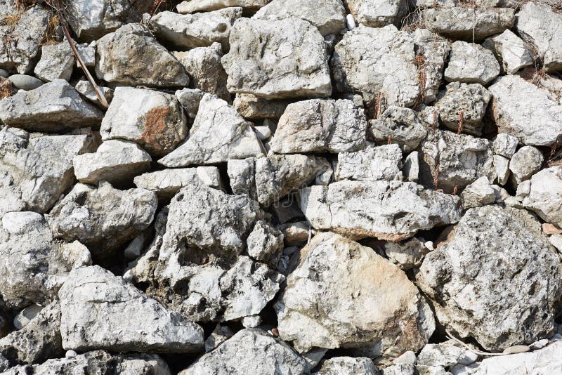 Rough Stones Dry Wall Background in Sunlight Stock Image - Image of ...