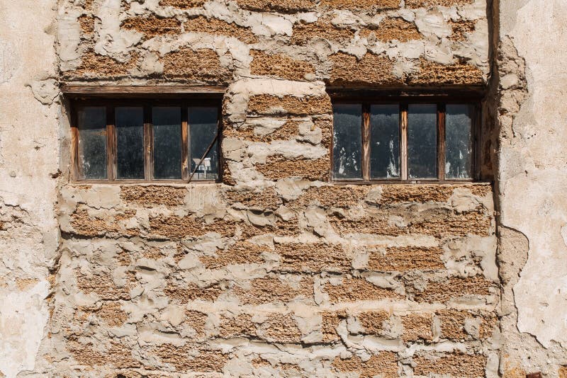 Rough Texture of a Brick Wall Made of Shells. Two Windows in an Old ...