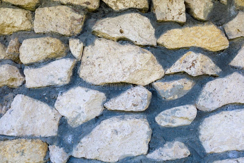 Rough Texture Wall Made of Blocks of Natural Stone. Background or ...
